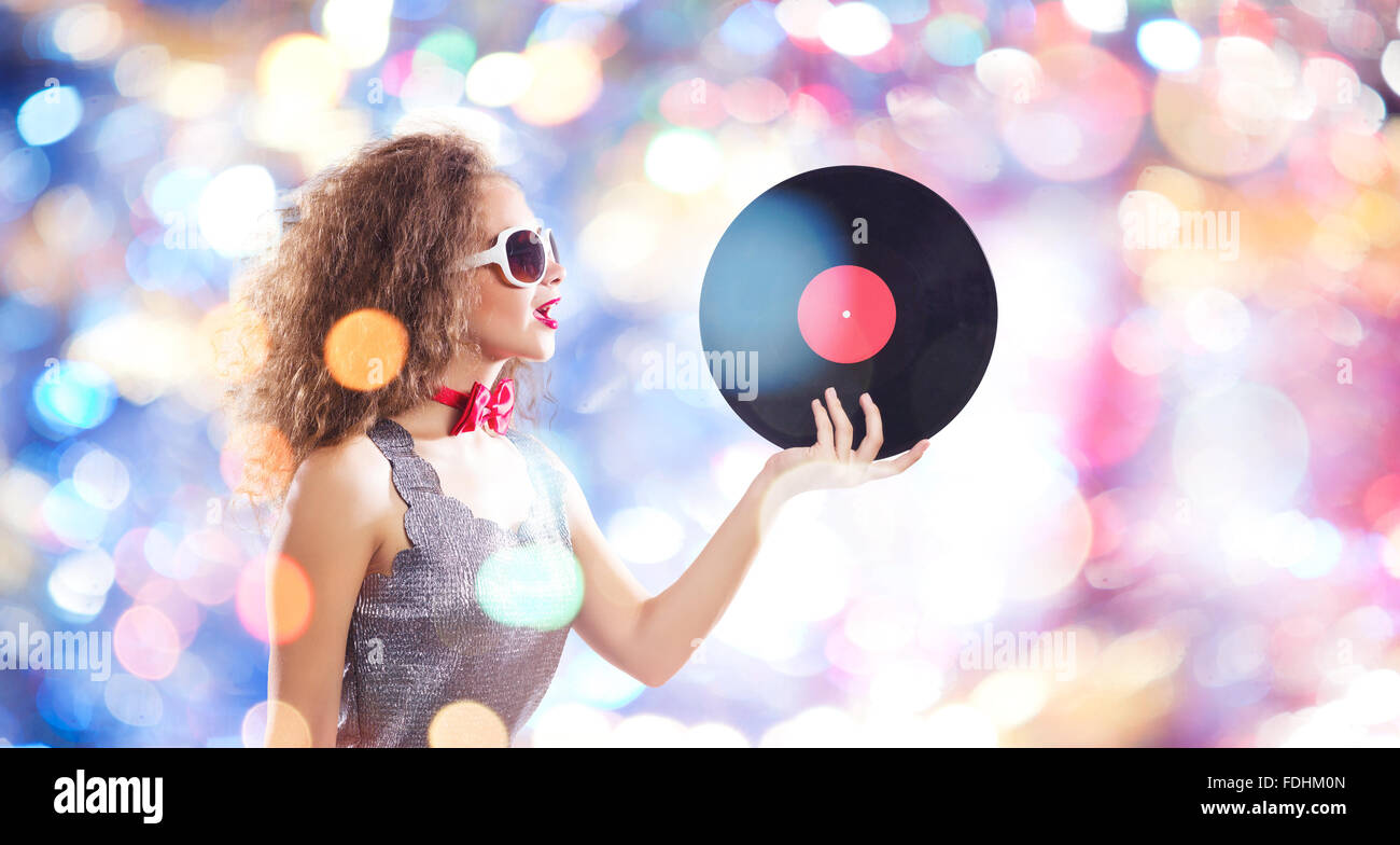 Young pretty girl dj at disco party holding vinyl Stock Photo - Alamy