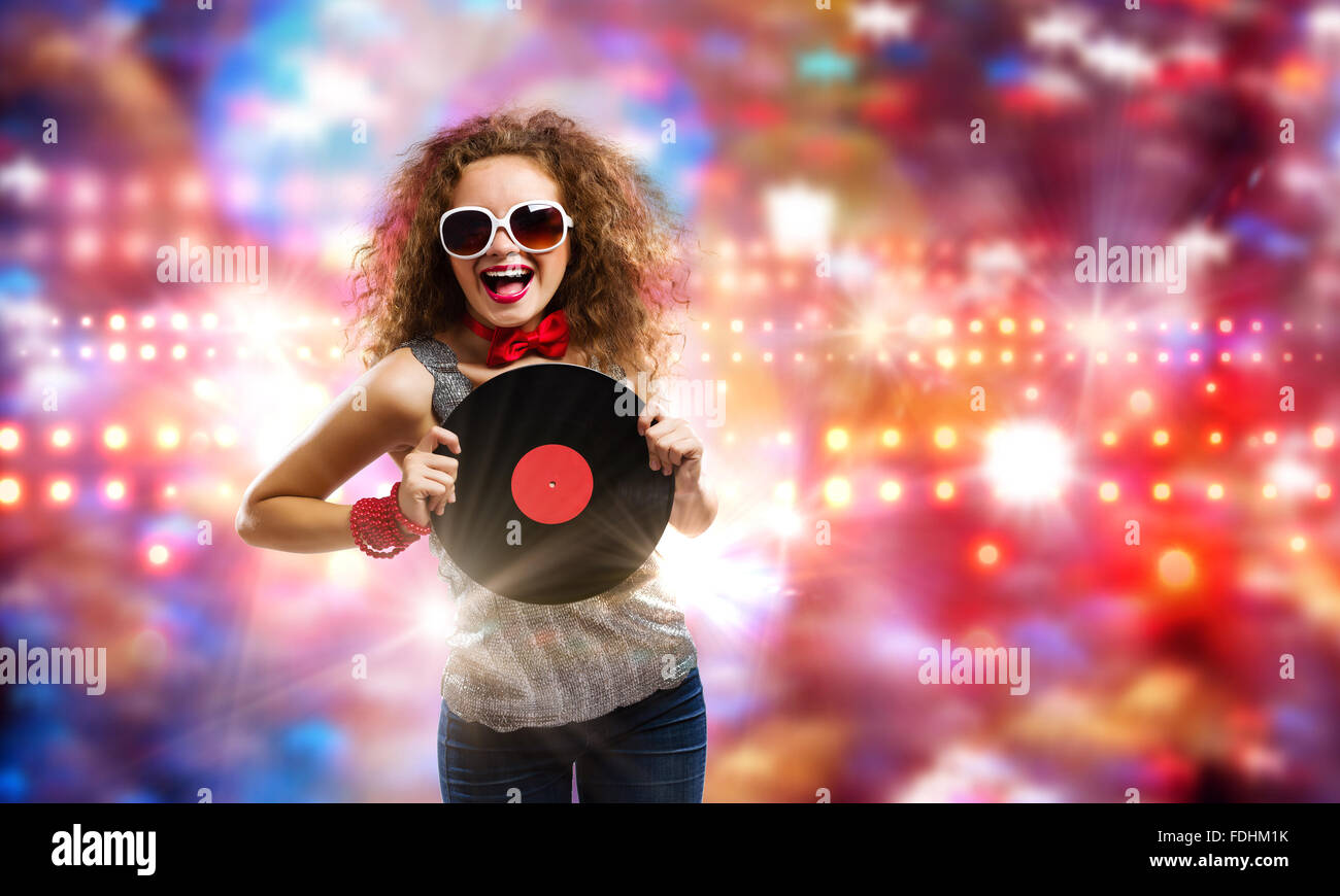 Young pretty girl dj at disco party holding vinyl Stock Photo - Alamy