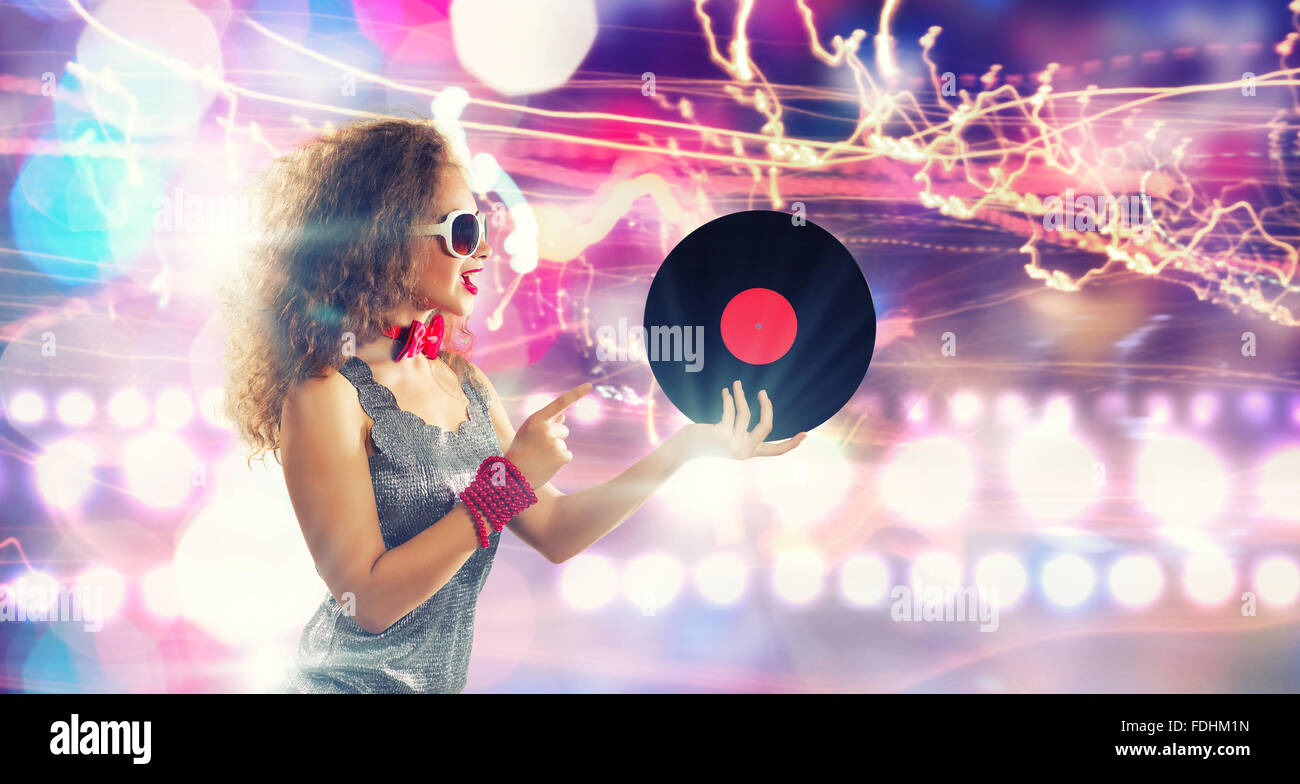Young pretty girl dj at disco party holding vinyl Stock Photo - Alamy