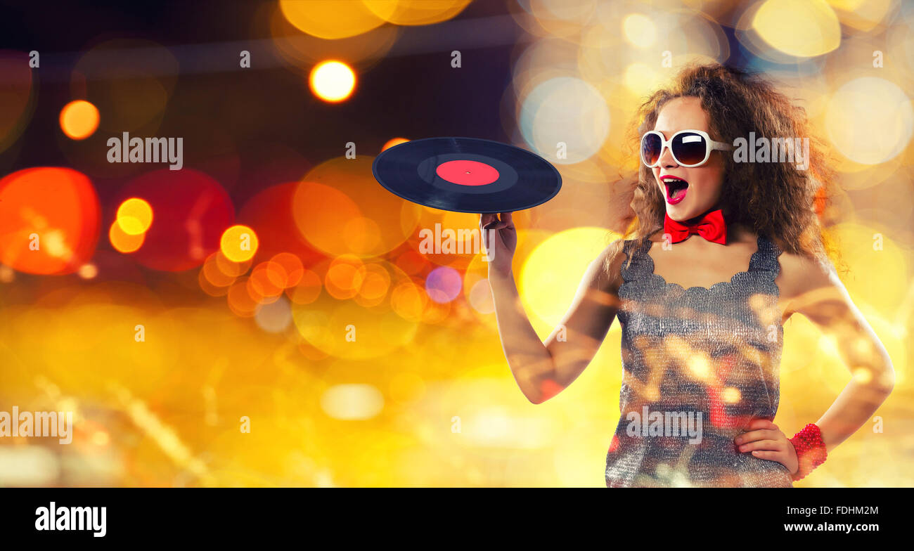 Young pretty girl dj at disco party holding vinyl Stock Photo - Alamy
