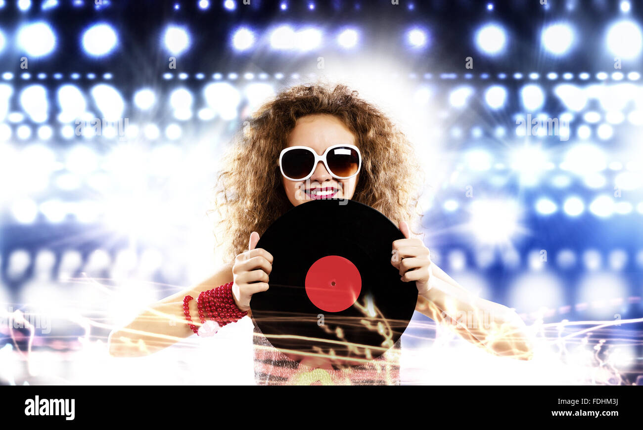 Young pretty girl dj at disco party holding vinyl Stock Photo - Alamy