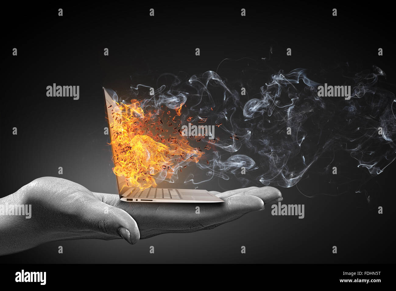Human hand holding burning laptop on palm Stock Photo - Alamy