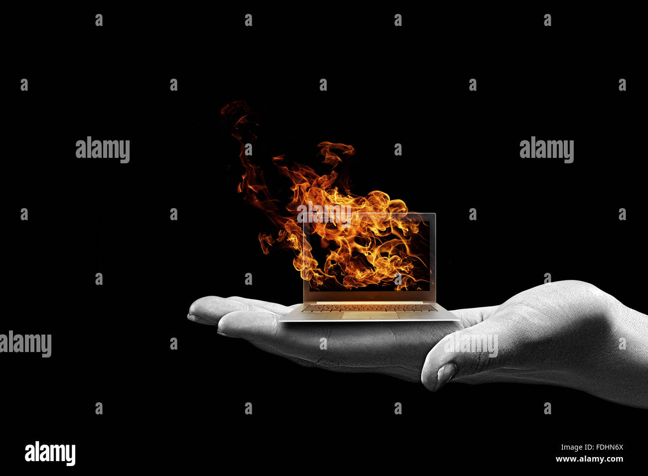 Human hand holding burning laptop on palm Stock Photo - Alamy