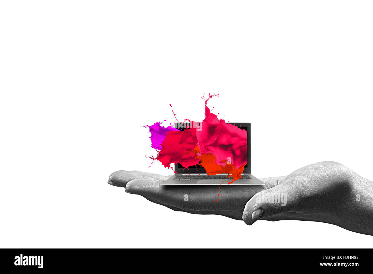 Close up of human hand holding laptop Stock Photo - Alamy