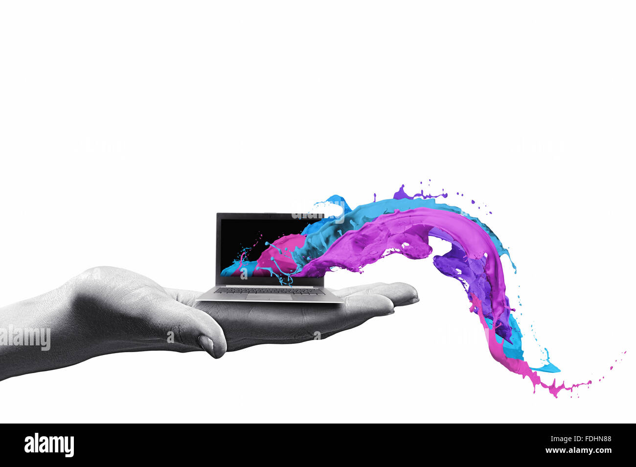 Close up of human hand holding laptop Stock Photo - Alamy