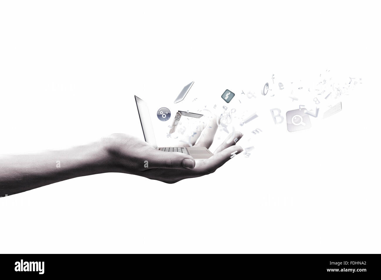 Close up of hand with laptop and media icons Stock Photo - Alamy