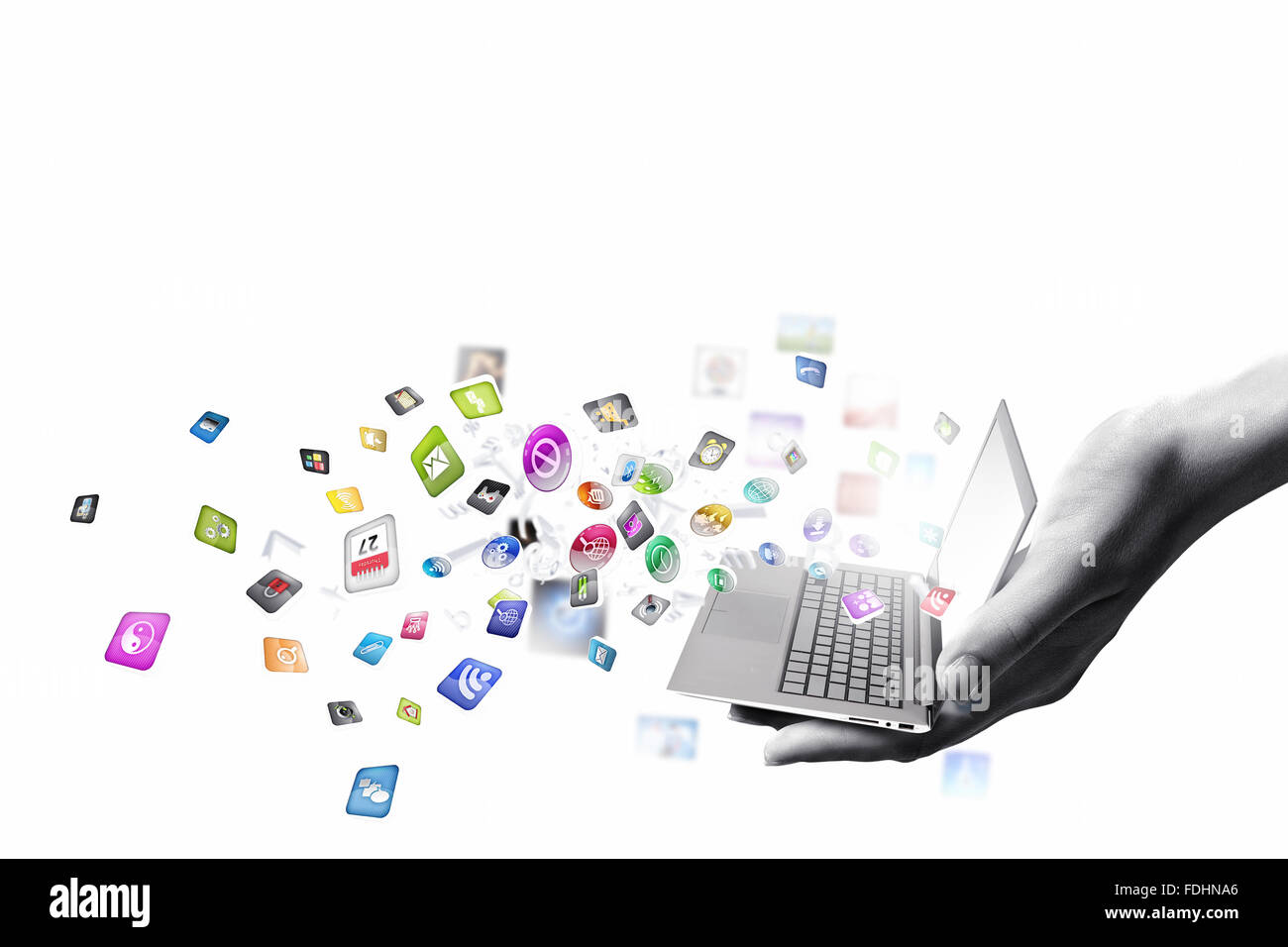 Close up of hand with laptop and media icons Stock Photo - Alamy