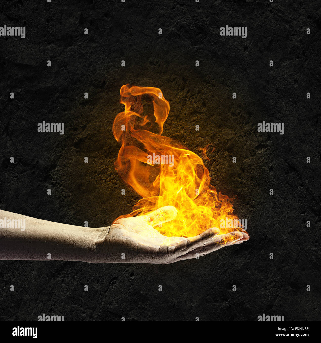 Close up of human hand holding fire flame Stock Photo - Alamy