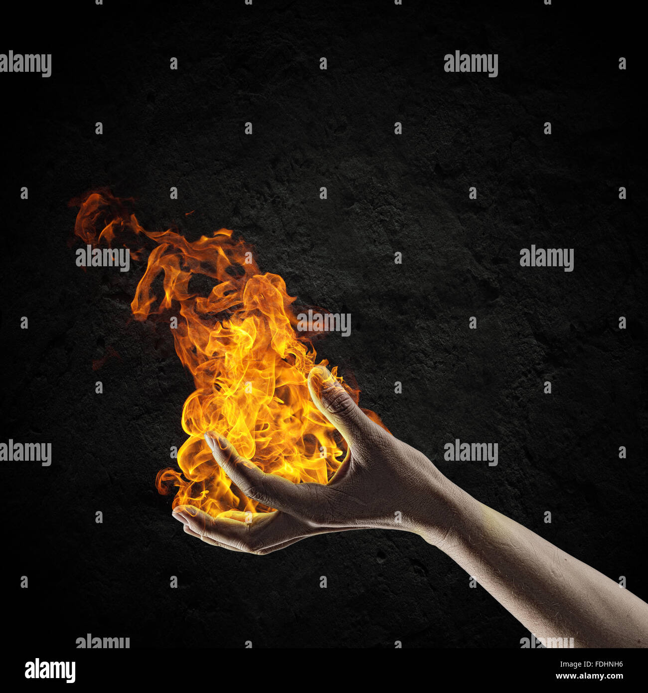 Close up of human hand holding fire flame Stock Photo - Alamy