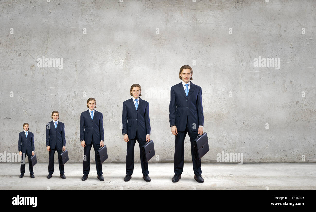 Successful confident businessmen standing in line. Progress in career ...