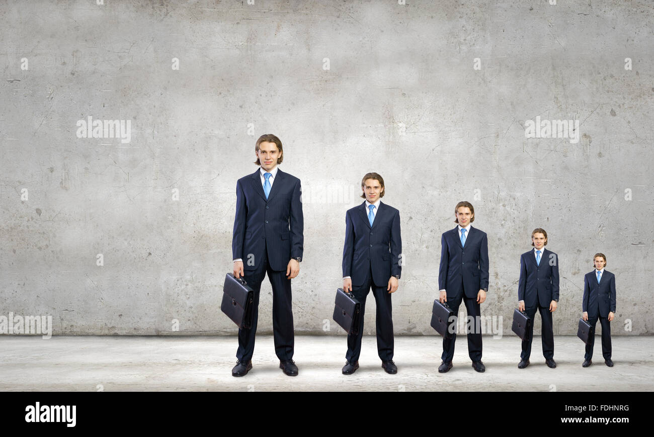 Successful confident businessmen standing in line. Progress in career ...