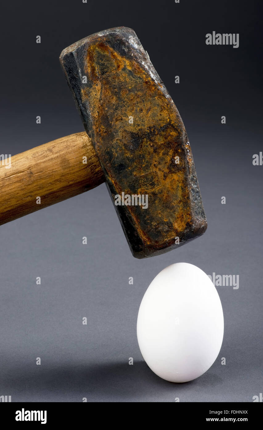 Hammer hitting egg hi-res stock photography and images - Alamy