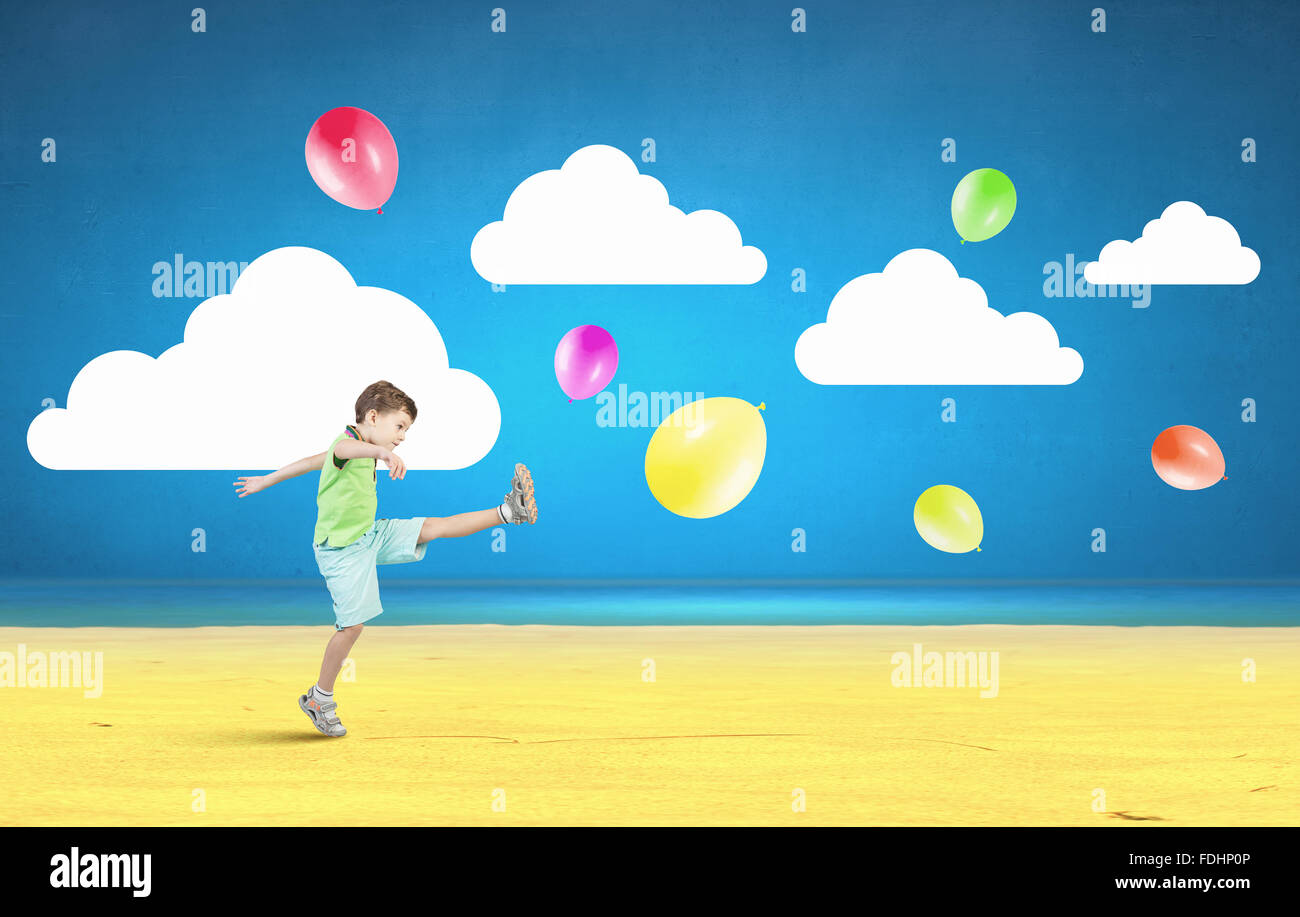 Little cute boy playing joyfully with colorful balloon Stock Photo - Alamy