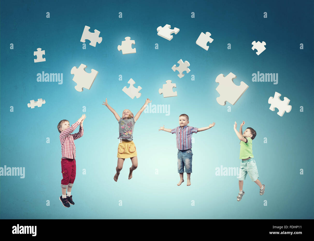 Group of children jumping high joyfully on colorful background Stock ...