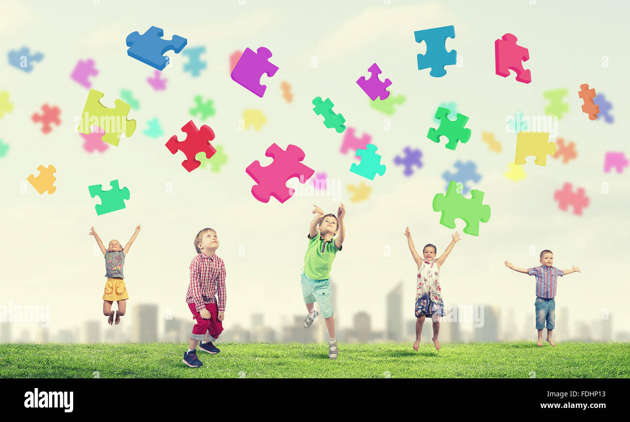 Group of children jumping high joyfully on natural background Stock ...