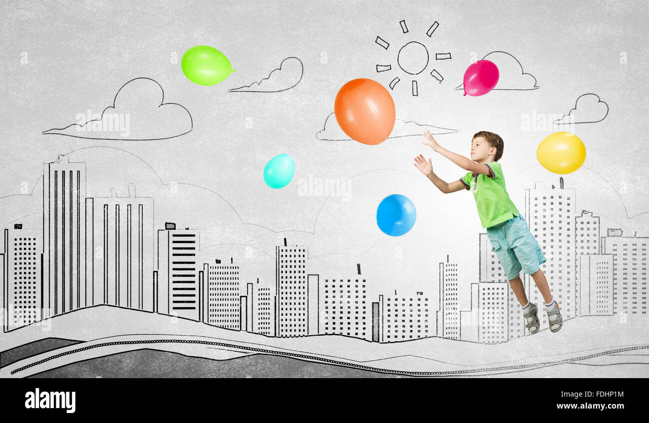 Little cute boy playing joyfully with colorful balloon Stock Photo - Alamy