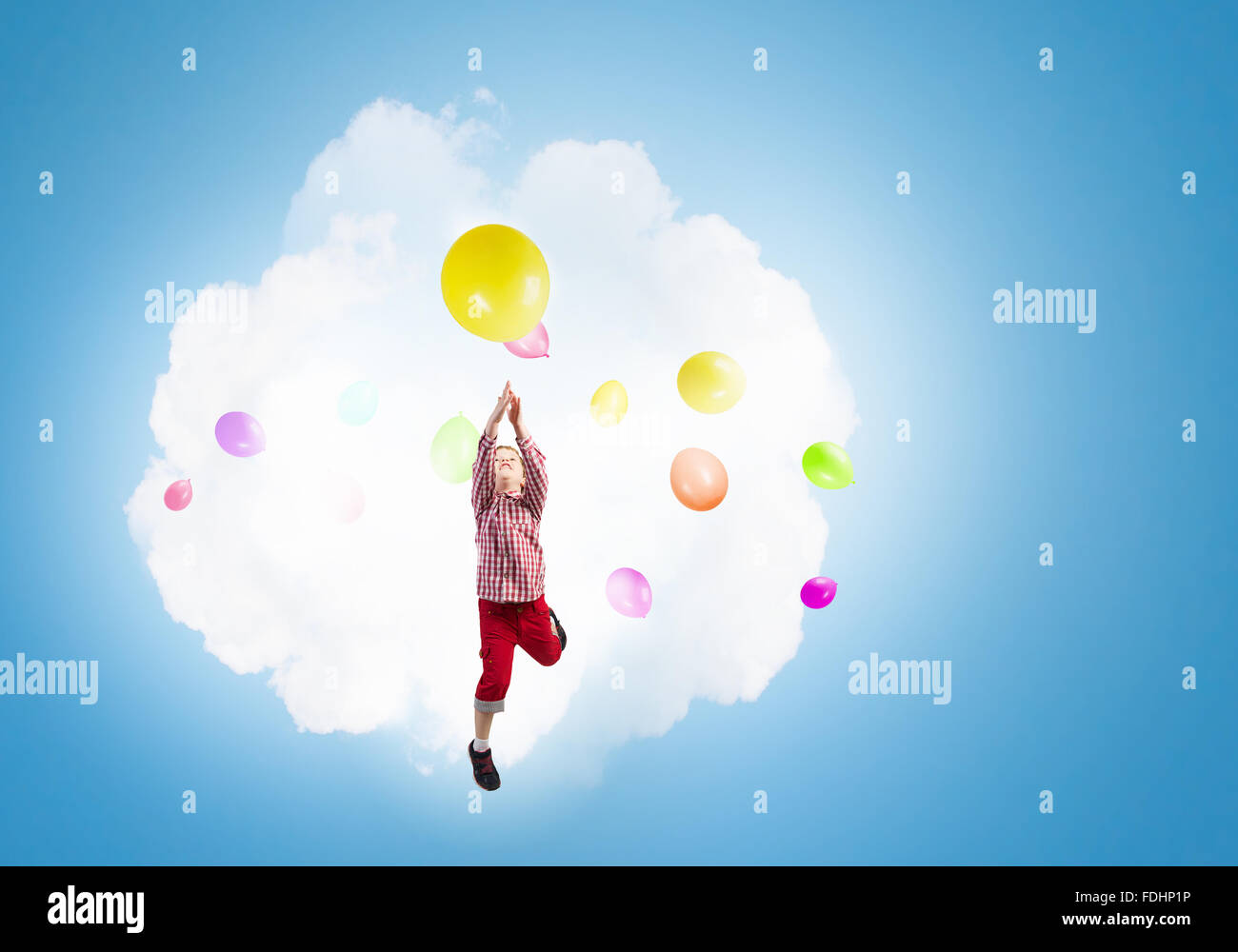 Little happy cute boy flying on balloon Stock Photo - Alamy