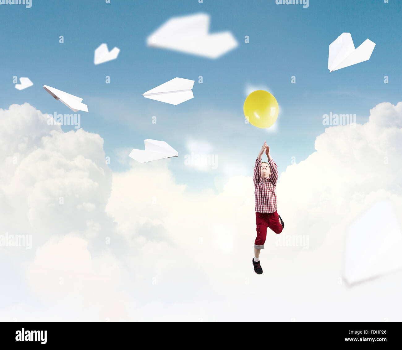 Little happy cute boy flying on balloon Stock Photo - Alamy