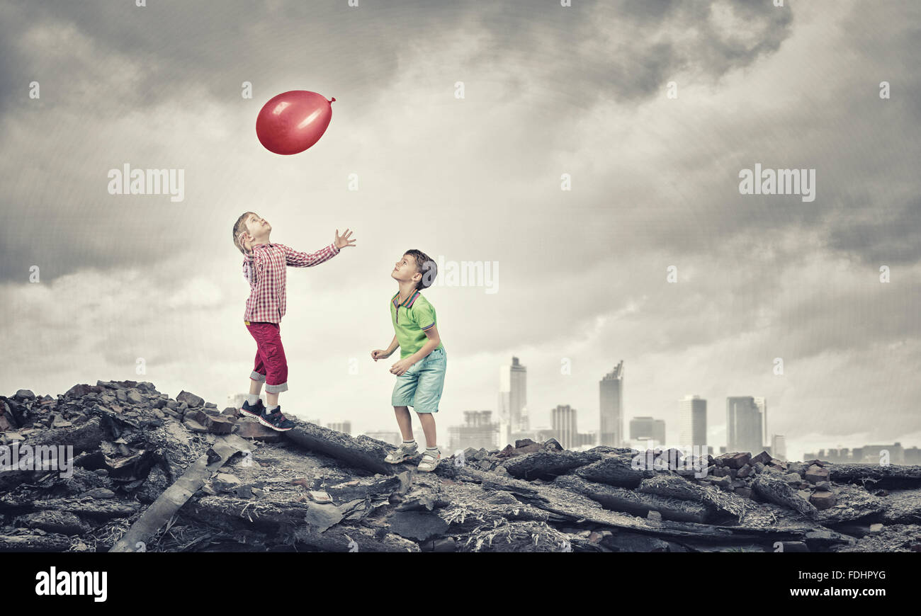 Little cute boys playing joyfully with colorful balloon Stock Photo - Alamy