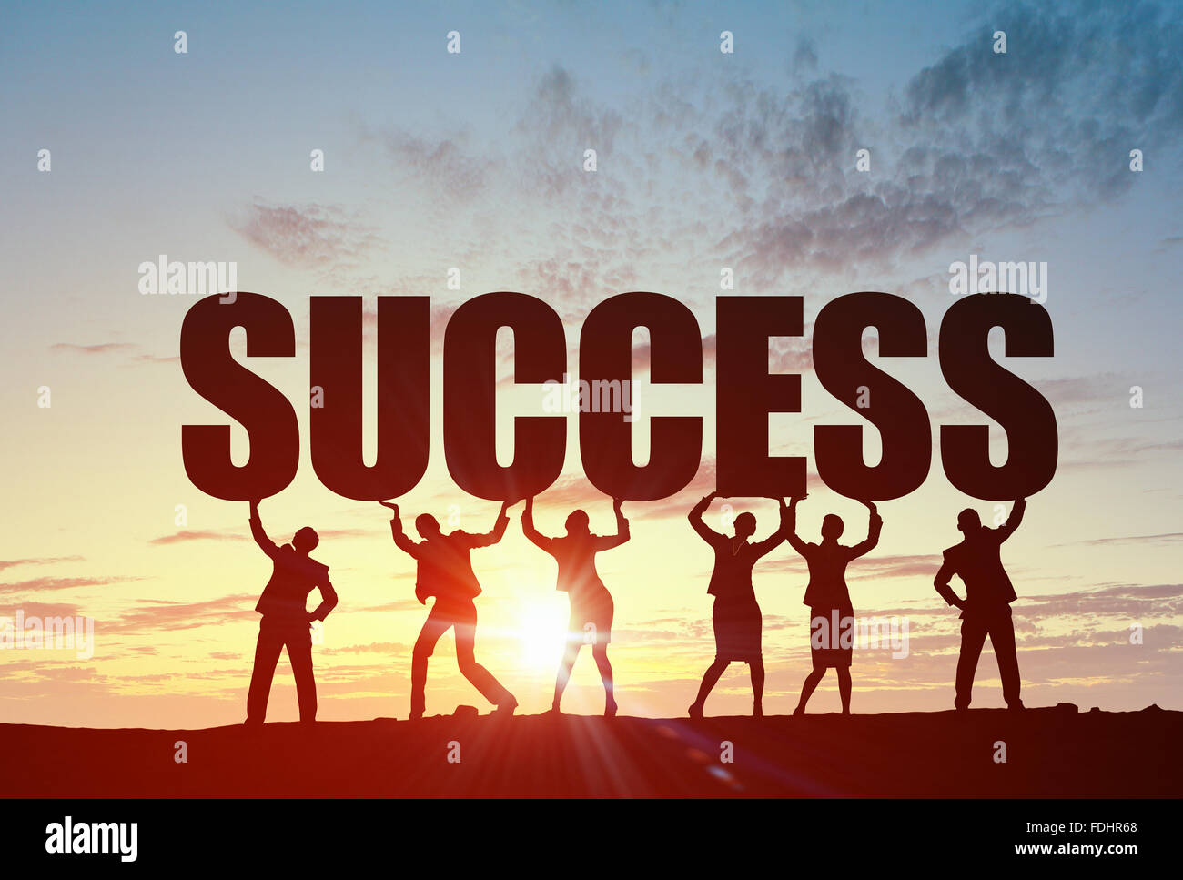Team teamwork lift man above head hi-res stock photography and images ...