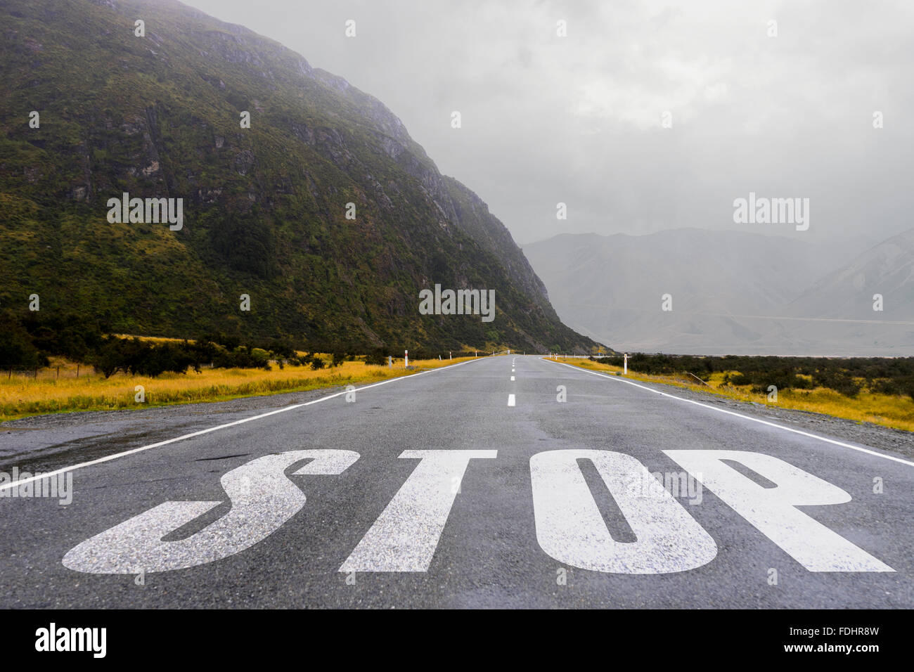Conceptual image with word stop on asphalt road Stock Photo - Alamy