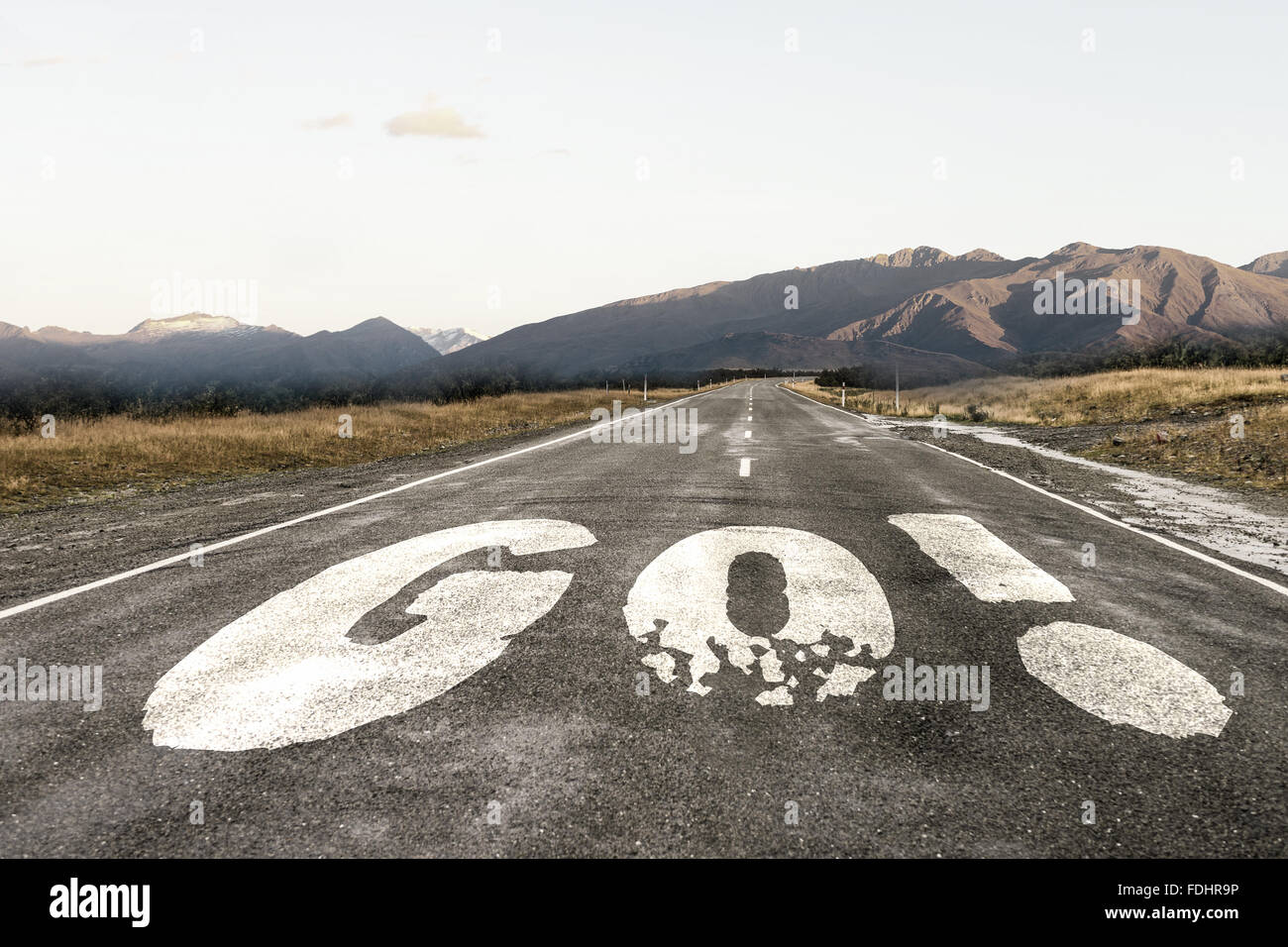 Conceptual image with word GO on asphalt road Stock Photo - Alamy