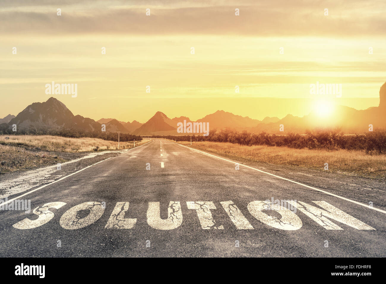 Natural landscape with word solution written on road Stock Photo - Alamy