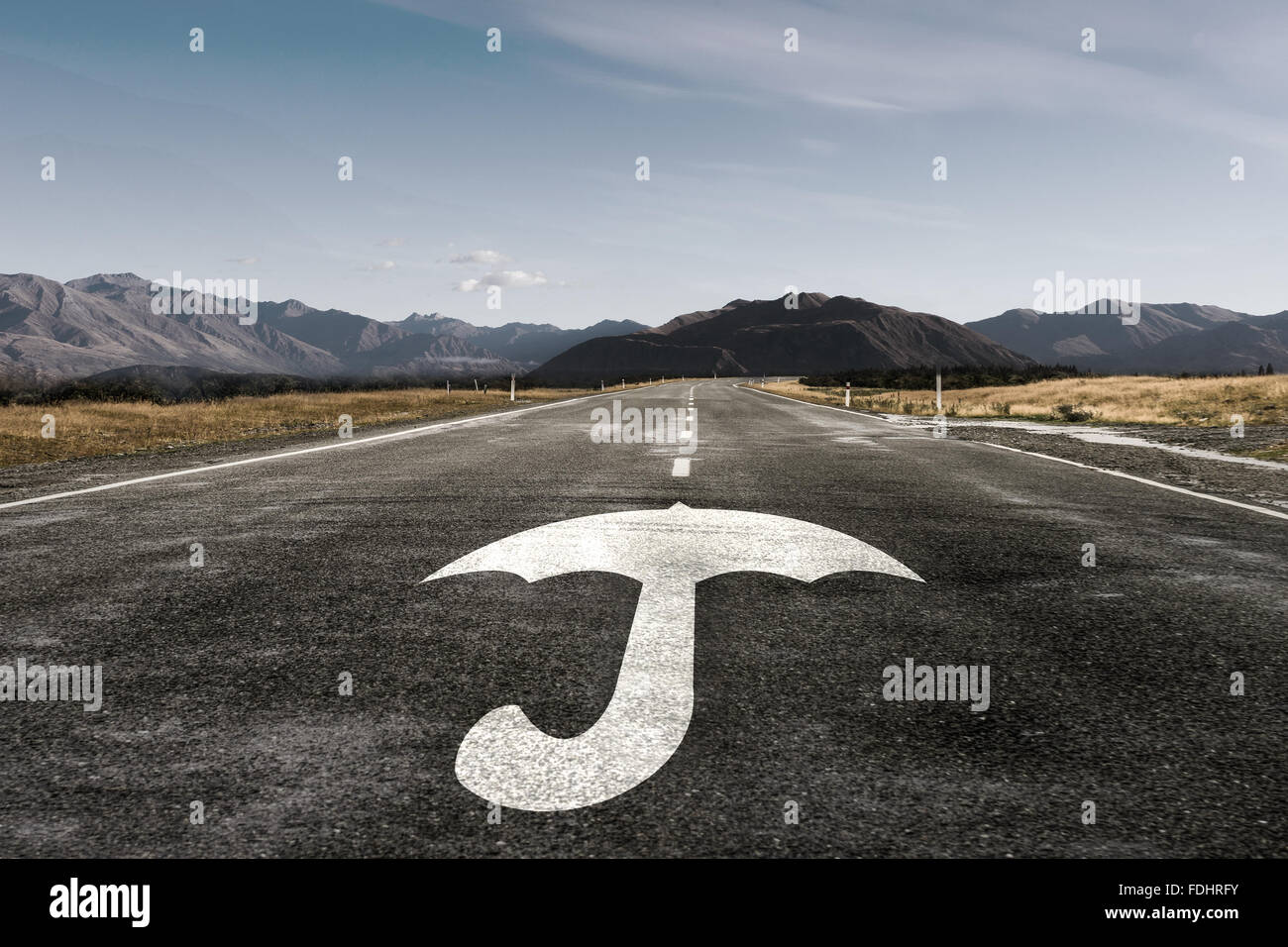 Umbrella package sign drawn on asphalt road Stock Photo - Alamy