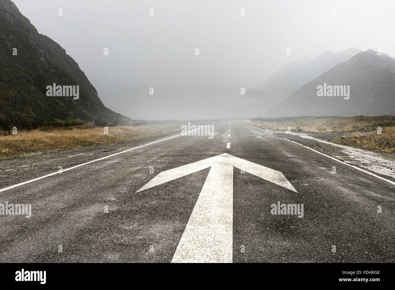 Natural landscape and asphalt road with forward arrow sign Stock Photo ...