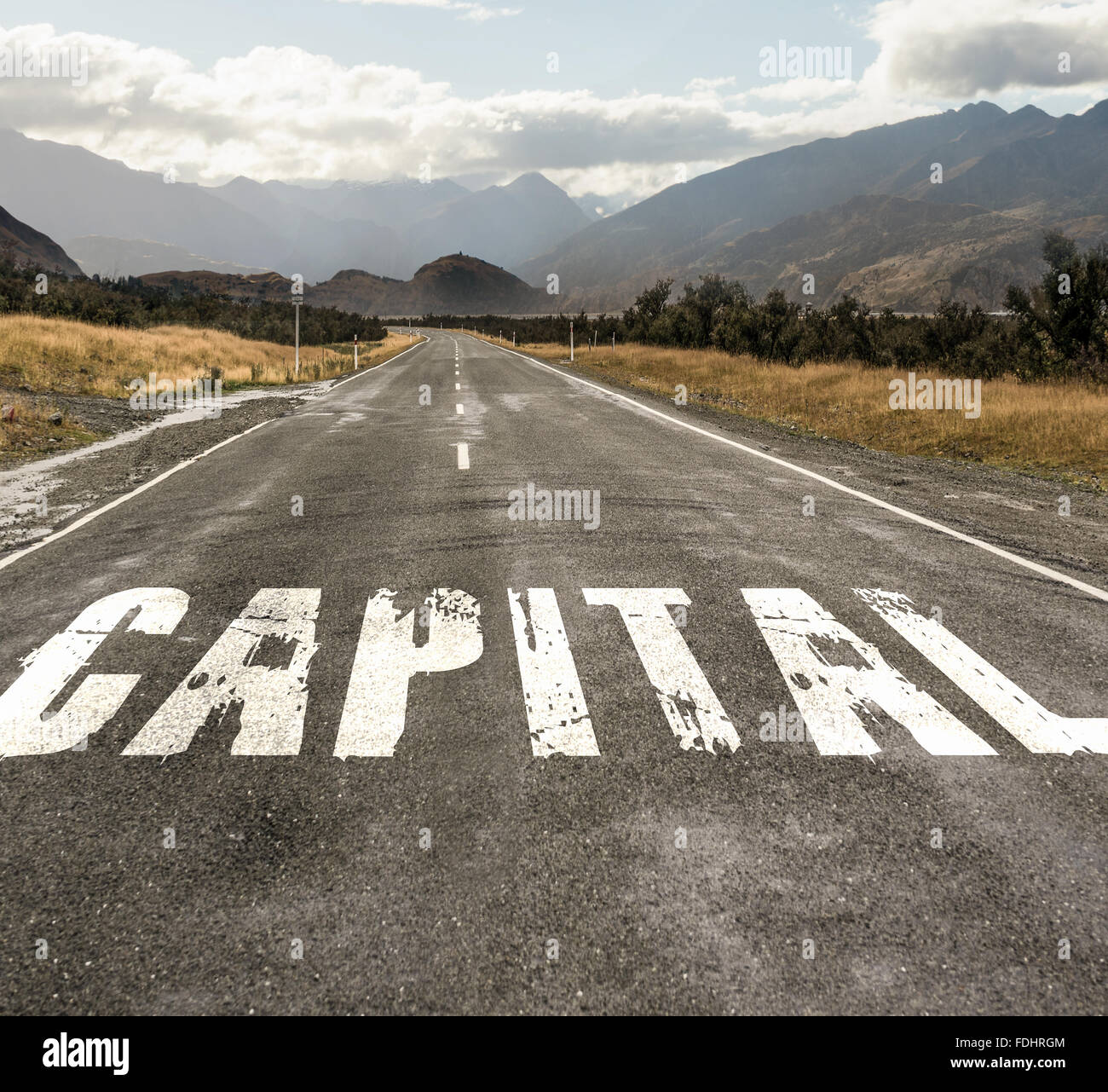 Asphalt road with business conceptual word drawn with white paint Stock ...