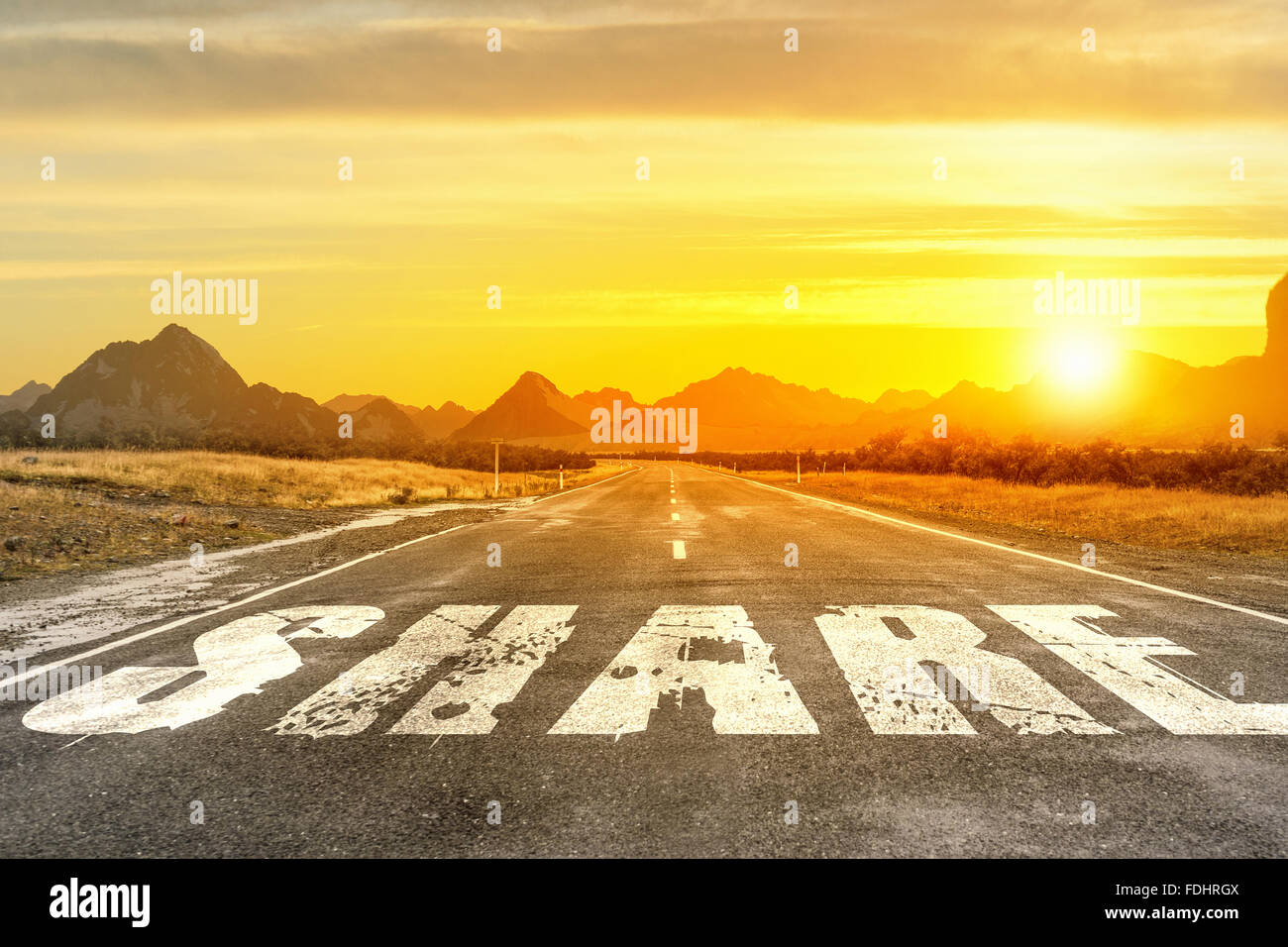 Asphalt road with business conceptual word drawn with white paint Stock ...