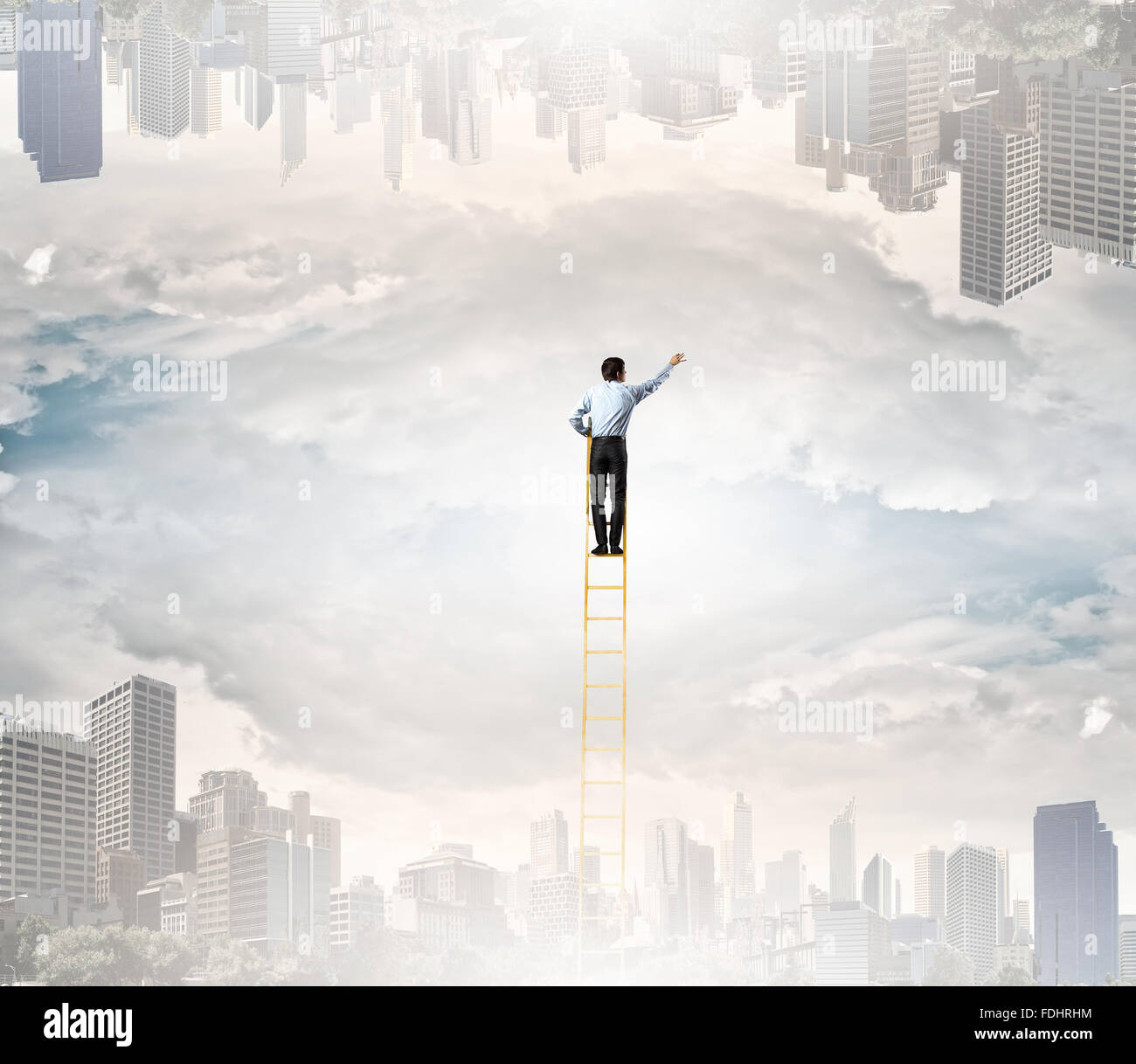 Businessman standing on ladder between two urban realities Stock Photo ...