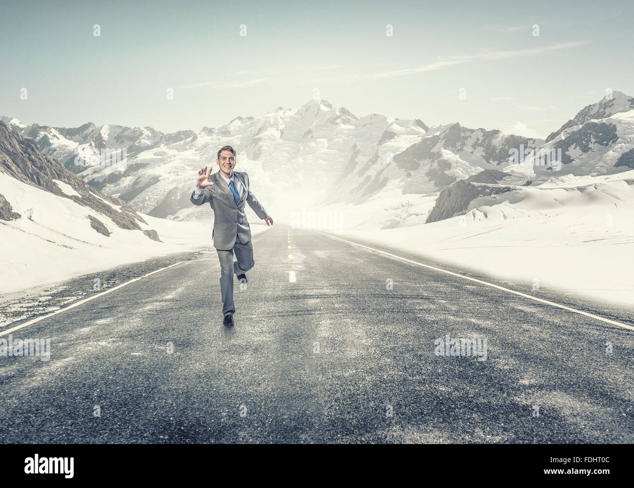 Young screaming businessman running on asphalt road Stock Photo - Alamy