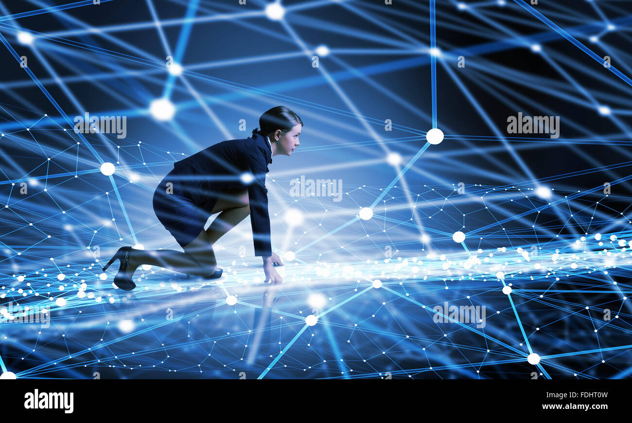 Young determined businesswoman standing in start position ready to ...