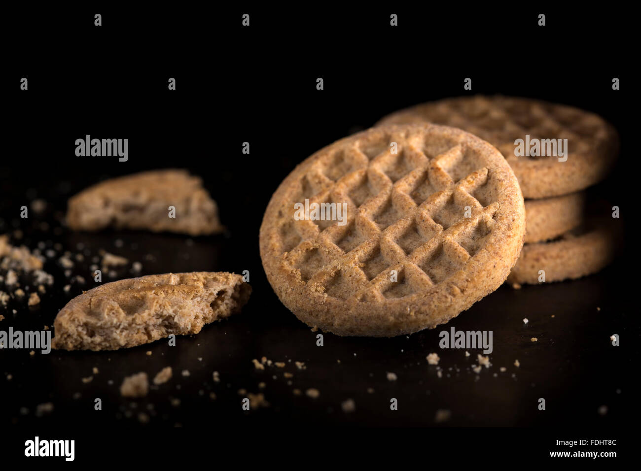 Biscuits made with cinnamon over black background Stock Photo - Alamy