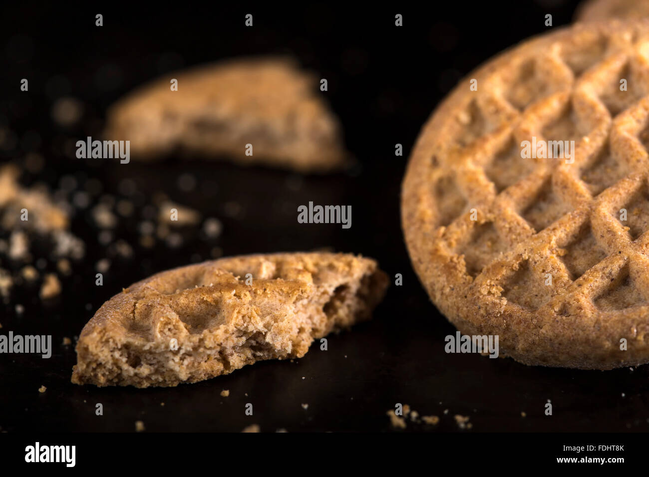 Biscuits made with cinnamon over black background Stock Photo - Alamy