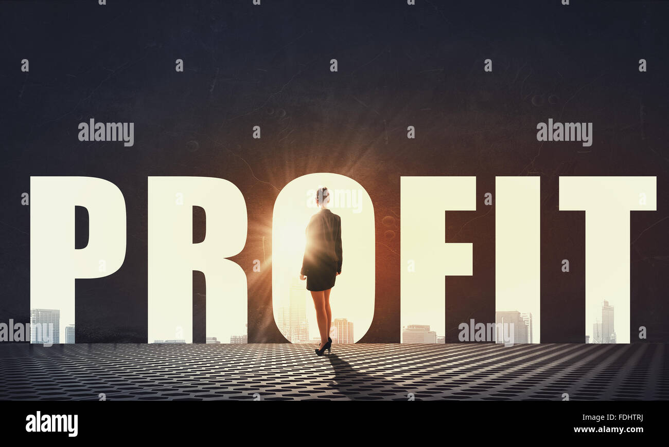 Back view of businesswoman standing in light of profit concept Stock ...