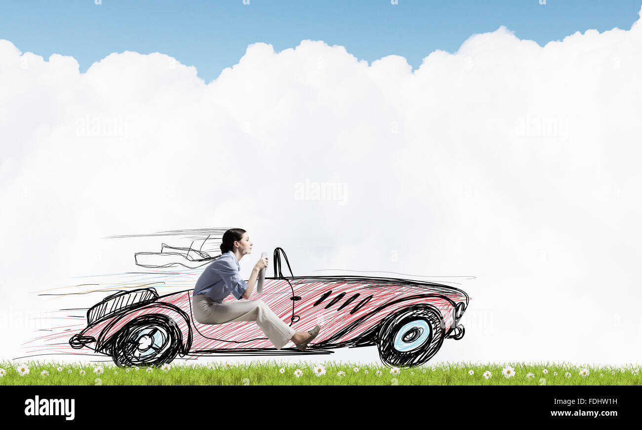 Young humorous woman driving drawn funny car Stock Photo - Alamy