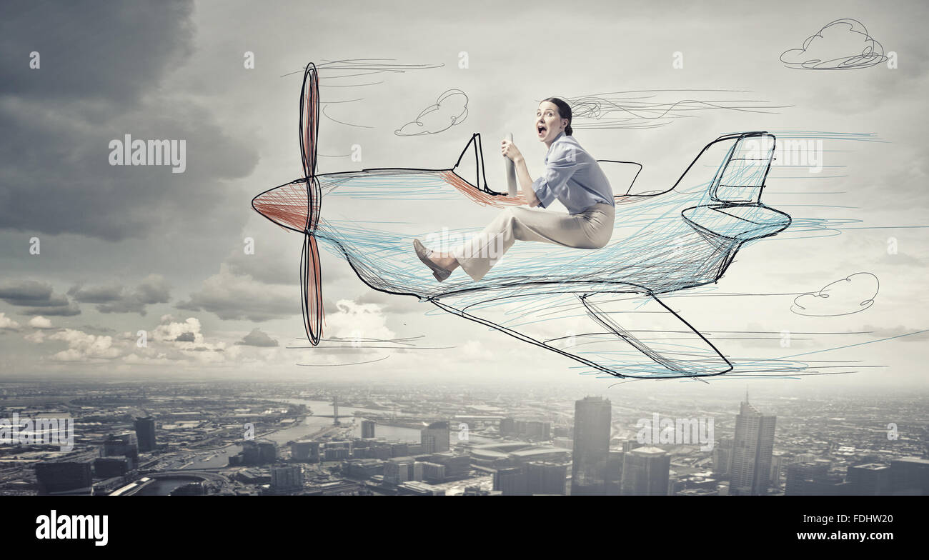 Young funny woman flying in air in drawn airplane Stock Photo - Alamy