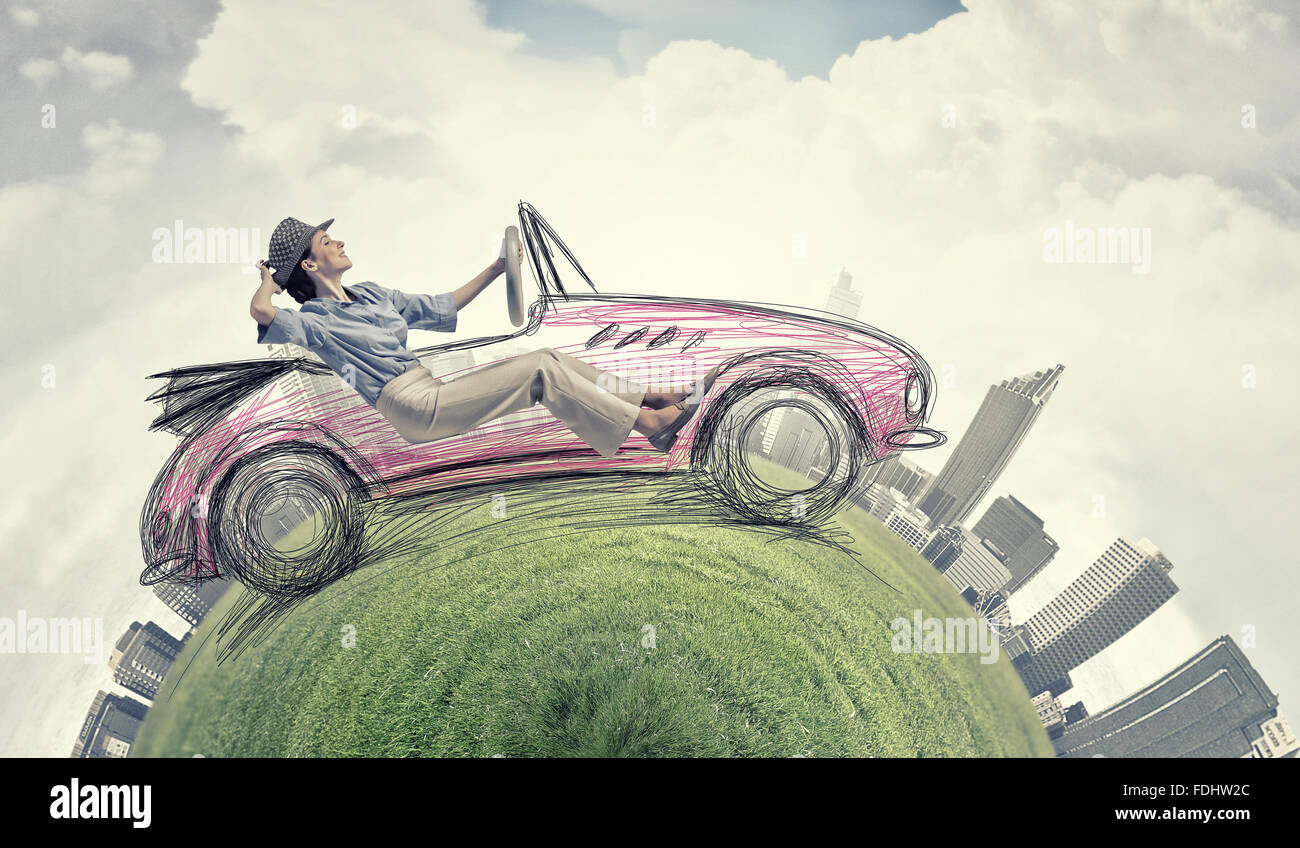 Young humorous woman driving drawn funny car Stock Photo - Alamy