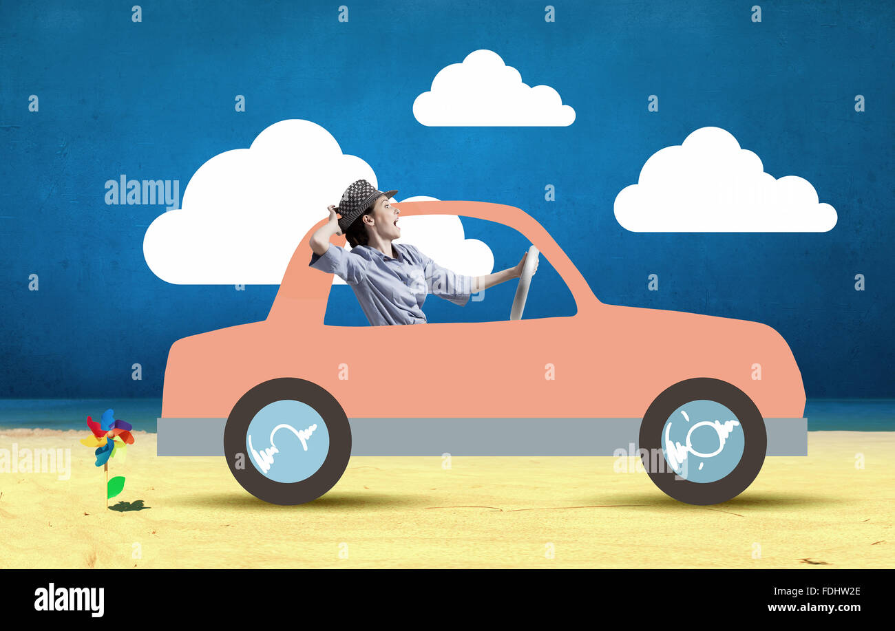 Young humorous woman driving drawn funny car Stock Photo - Alamy