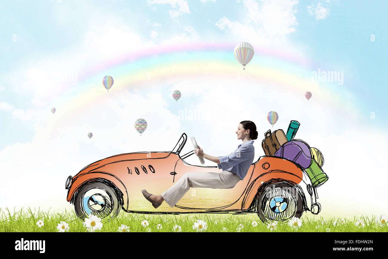 Young humorous woman driving drawn funny car Stock Photo - Alamy