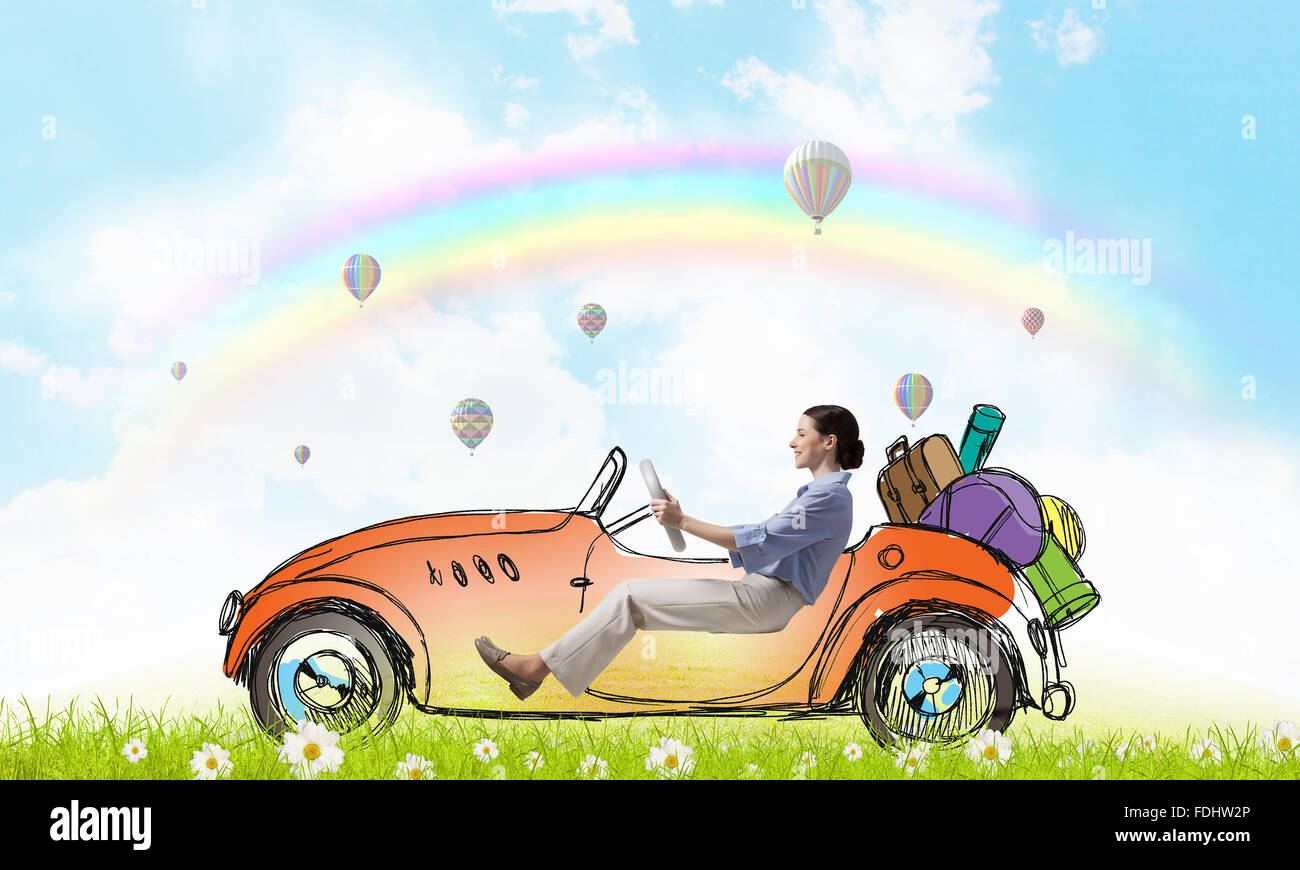 Young humorous woman driving drawn funny car Stock Photo - Alamy