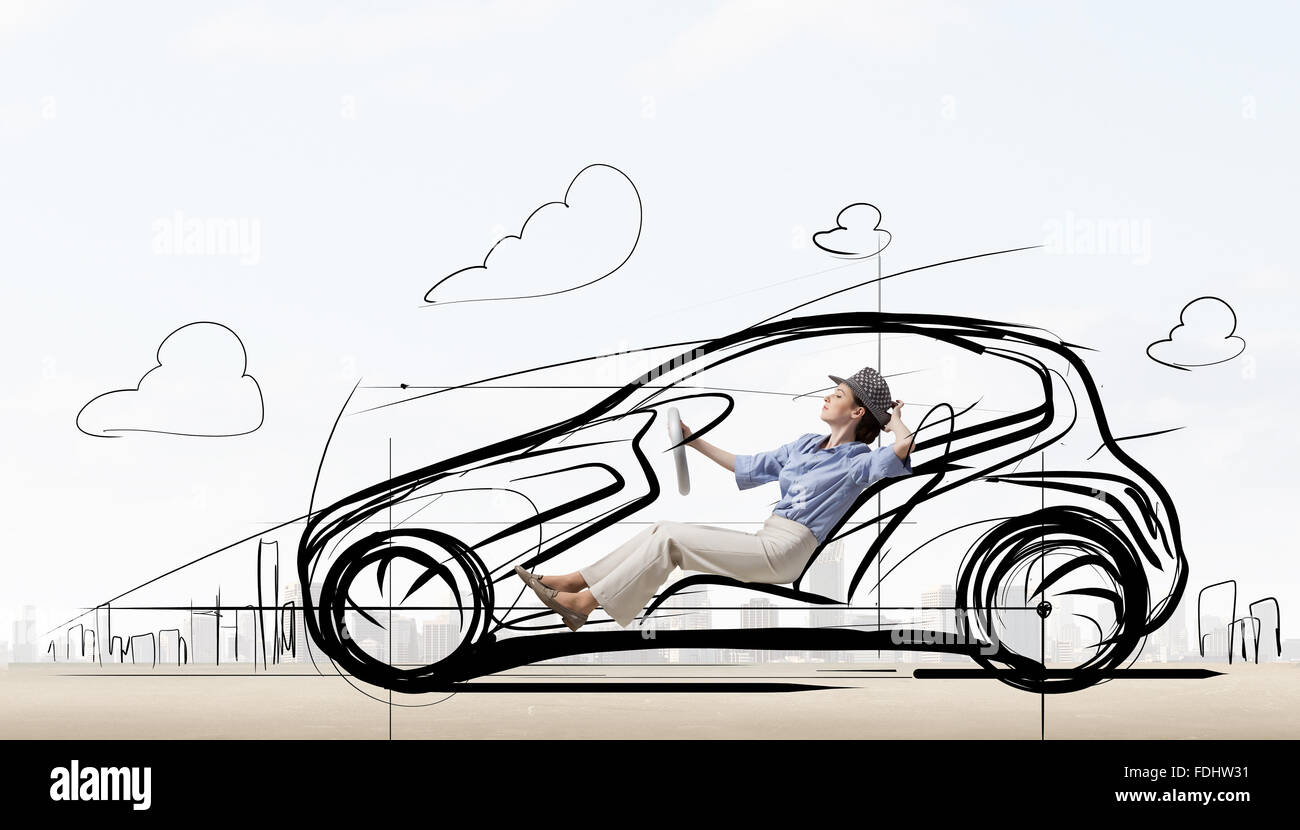 Young humorous woman driving drawn funny car Stock Photo - Alamy