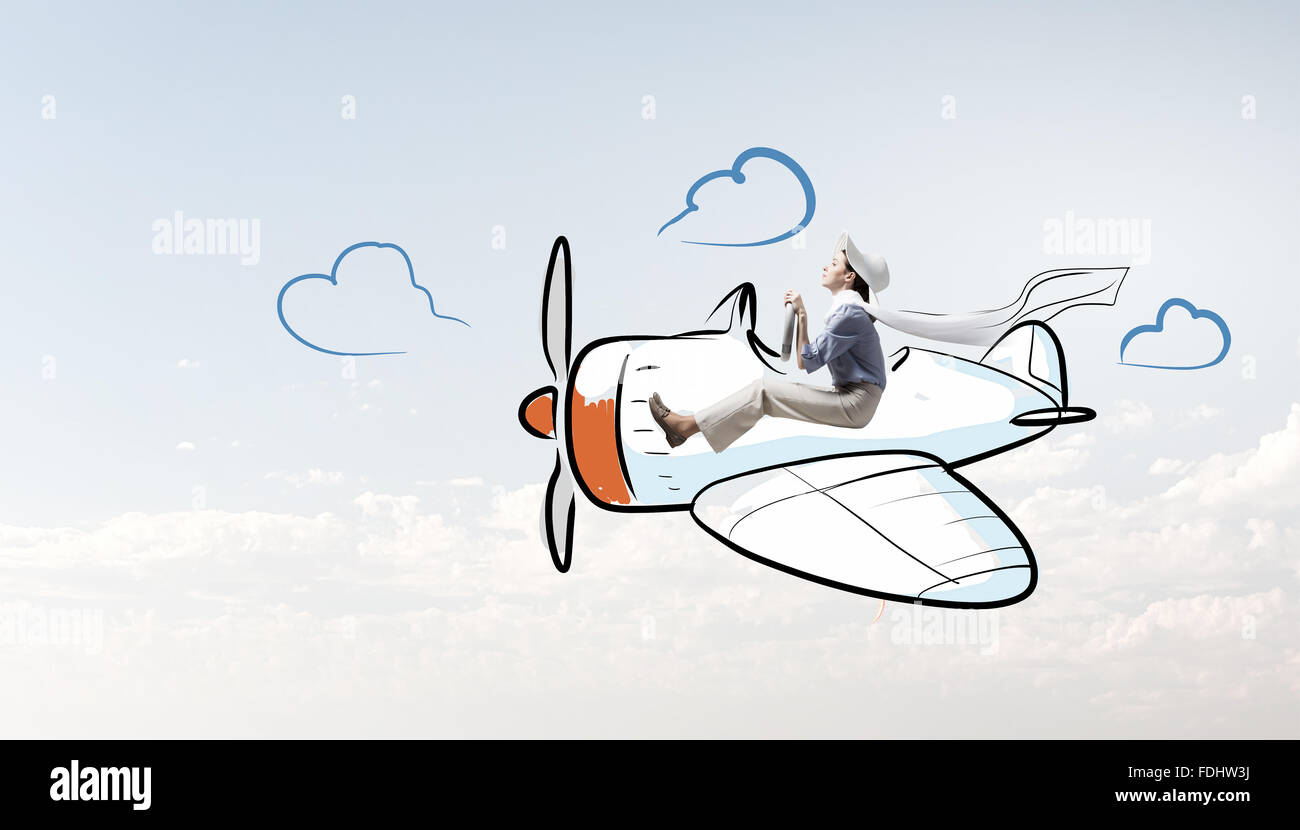 Young funny woman flying in air in drawn airplane Stock Photo - Alamy