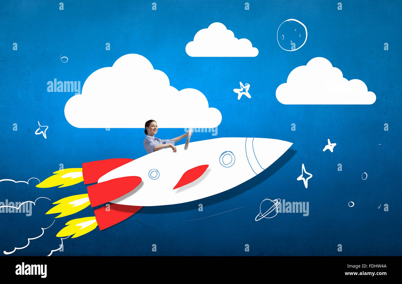 Young happy student girl riding fast drawn rocket Stock Photo - Alamy