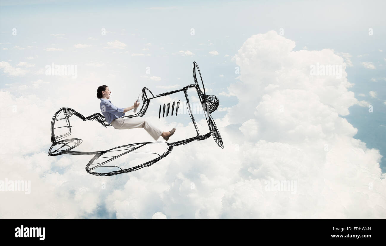 Young funny woman flying in air in drawn airplane Stock Photo - Alamy
