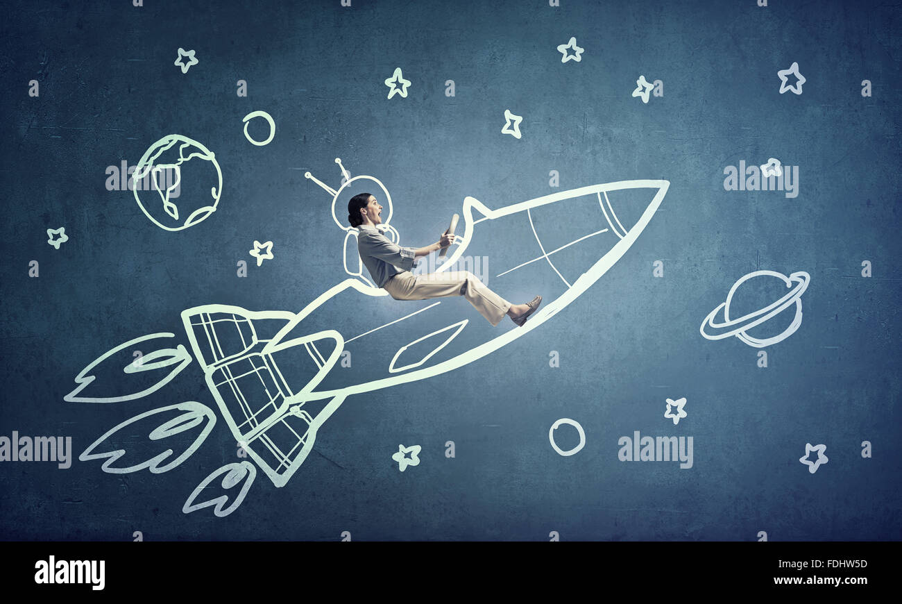 Young happy student girl riding fast drawn rocket Stock Photo - Alamy