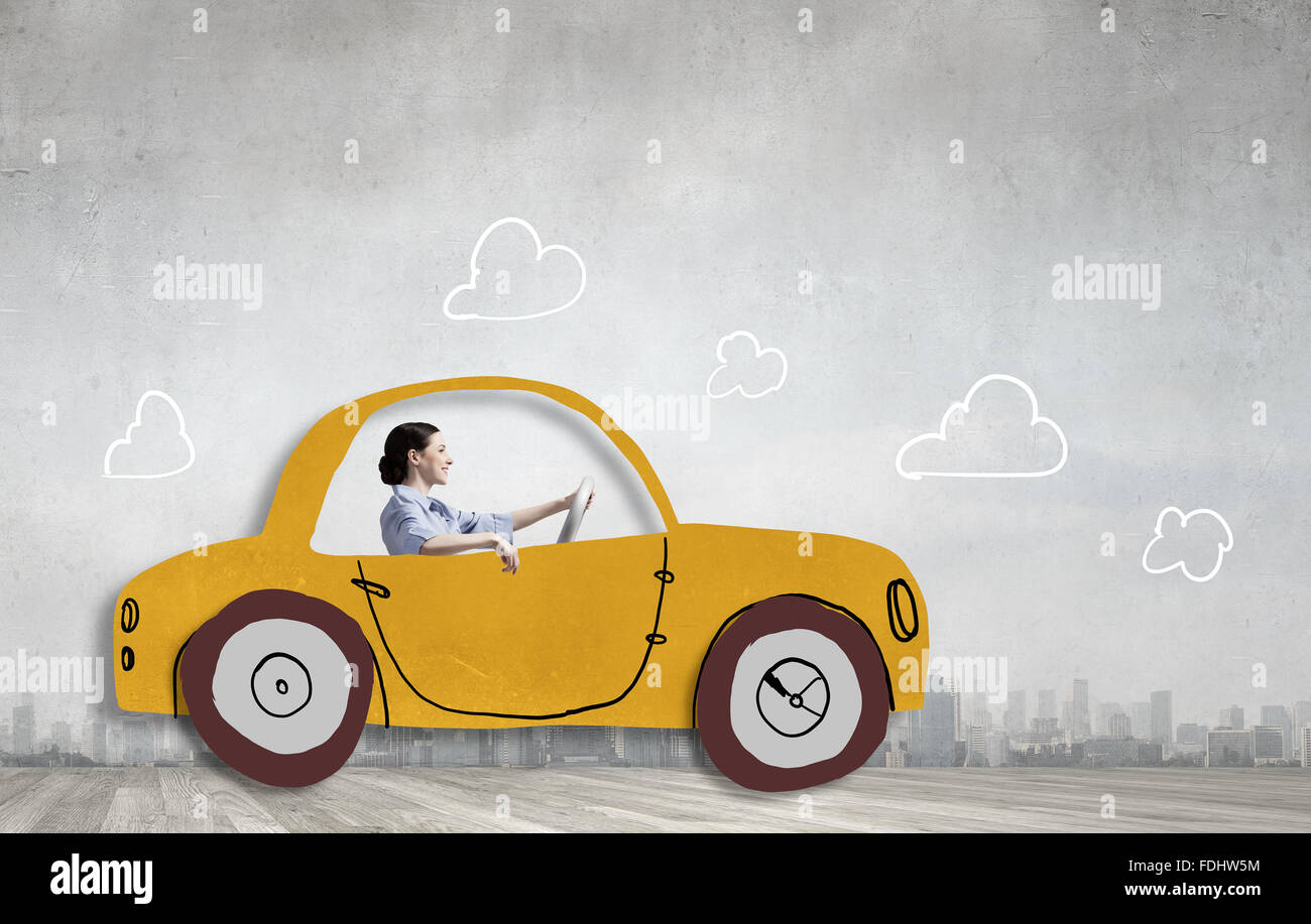 Young humorous woman driving drawn funny car Stock Photo - Alamy