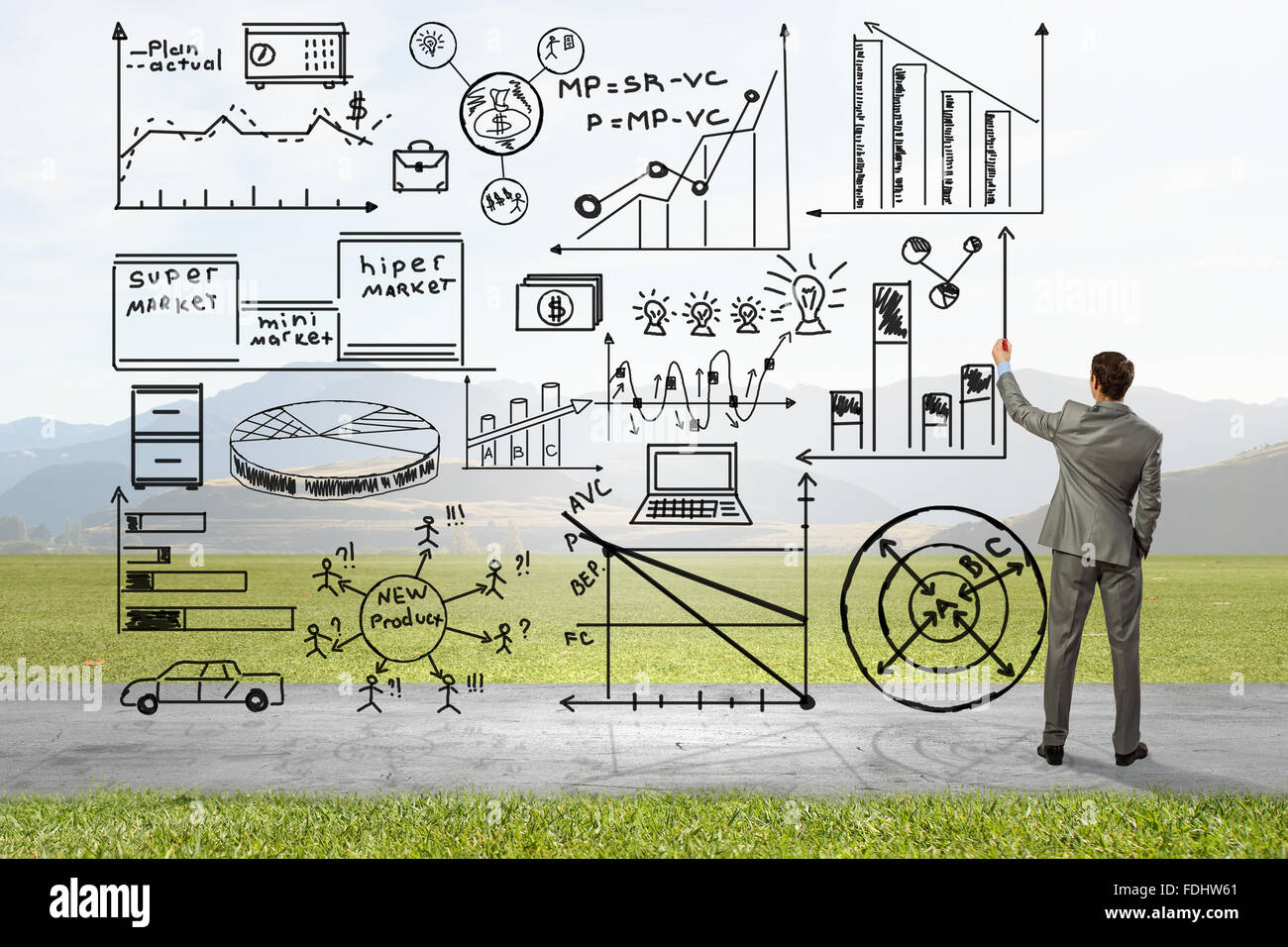 Back view of businessman drawing plan sketches on wall Stock Photo - Alamy